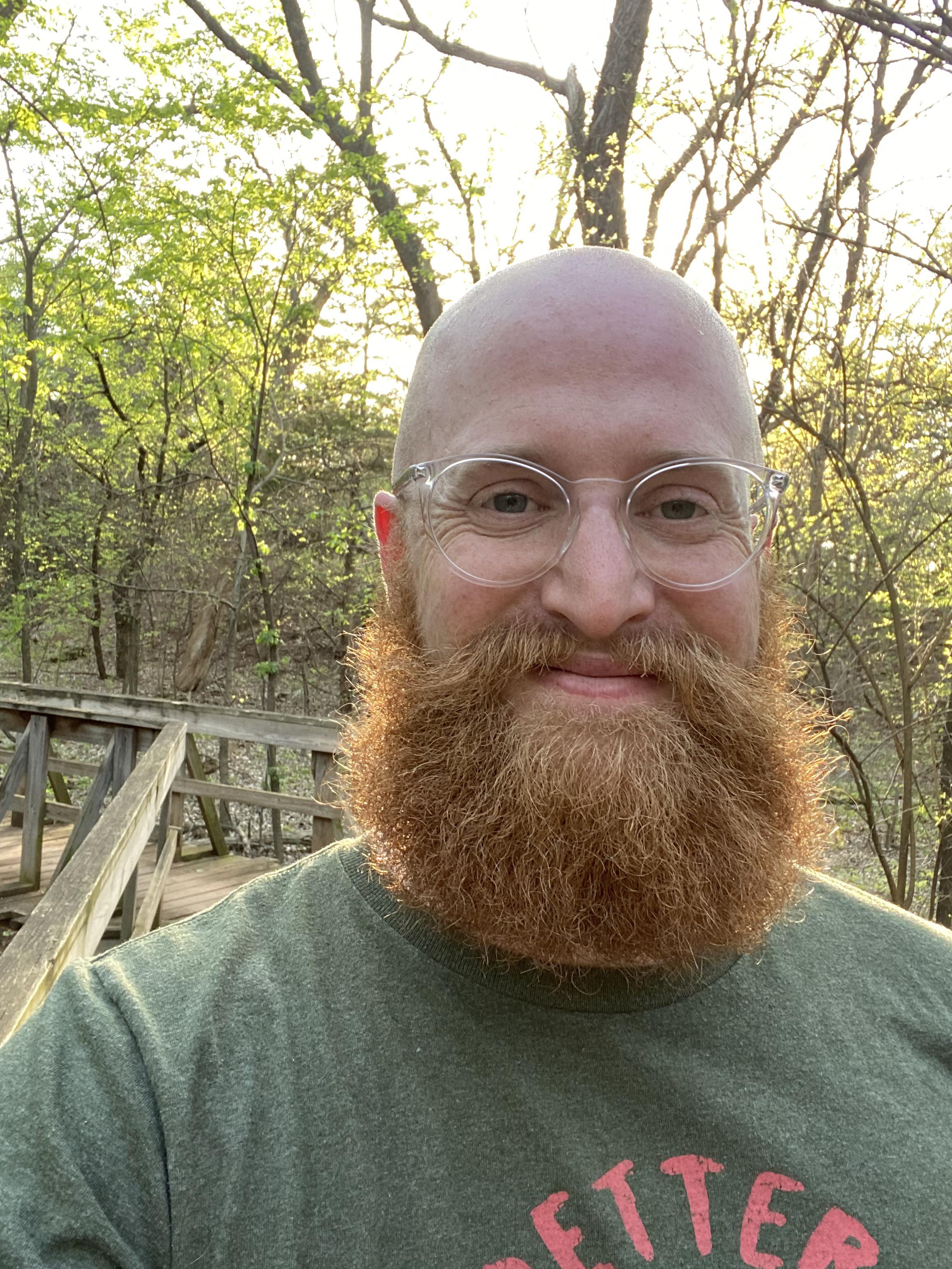 Shaved head burly beard. | Scrolller