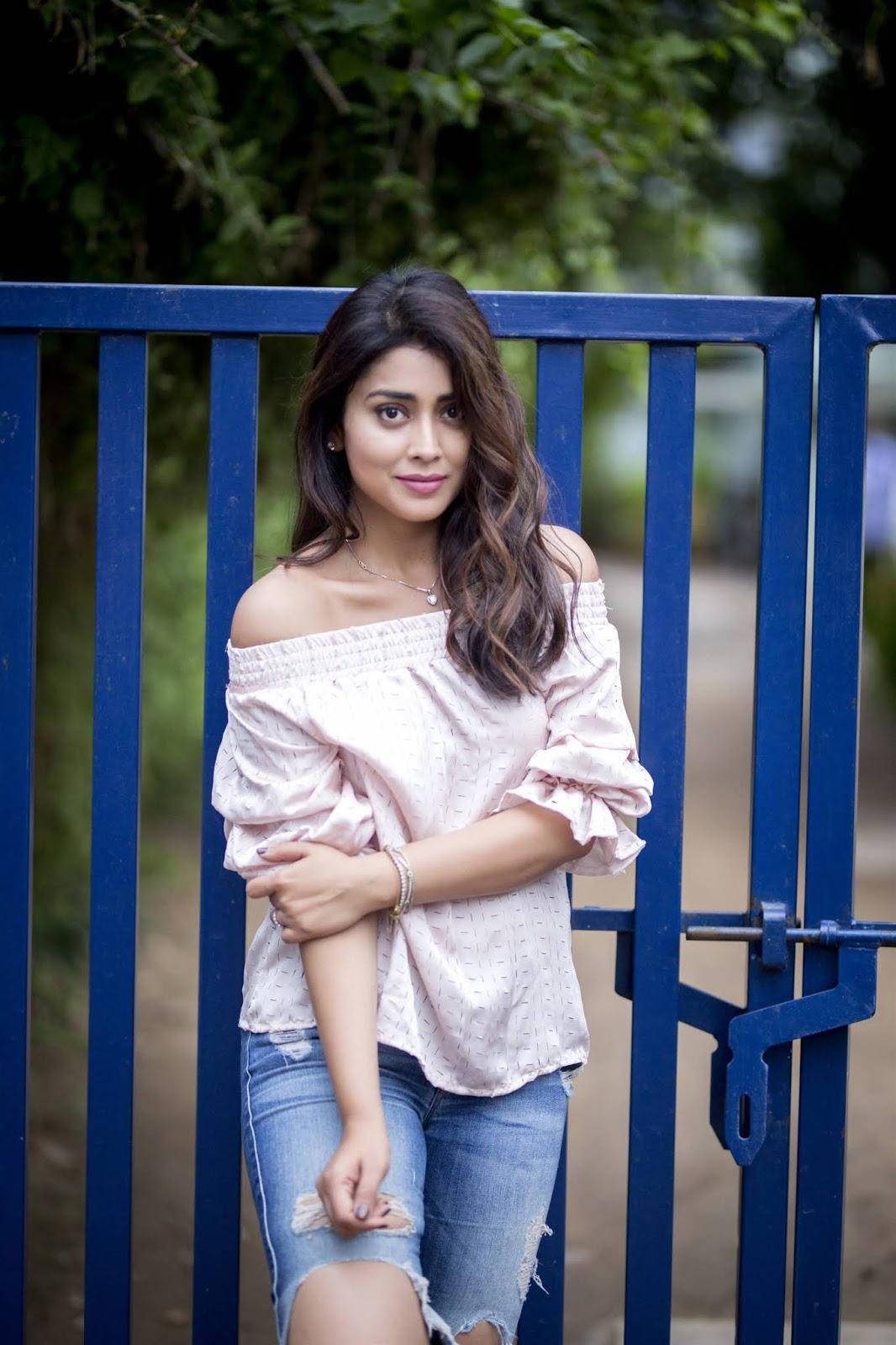 Shriya Saran in off shoulder top and ripped jeans | Scrolller