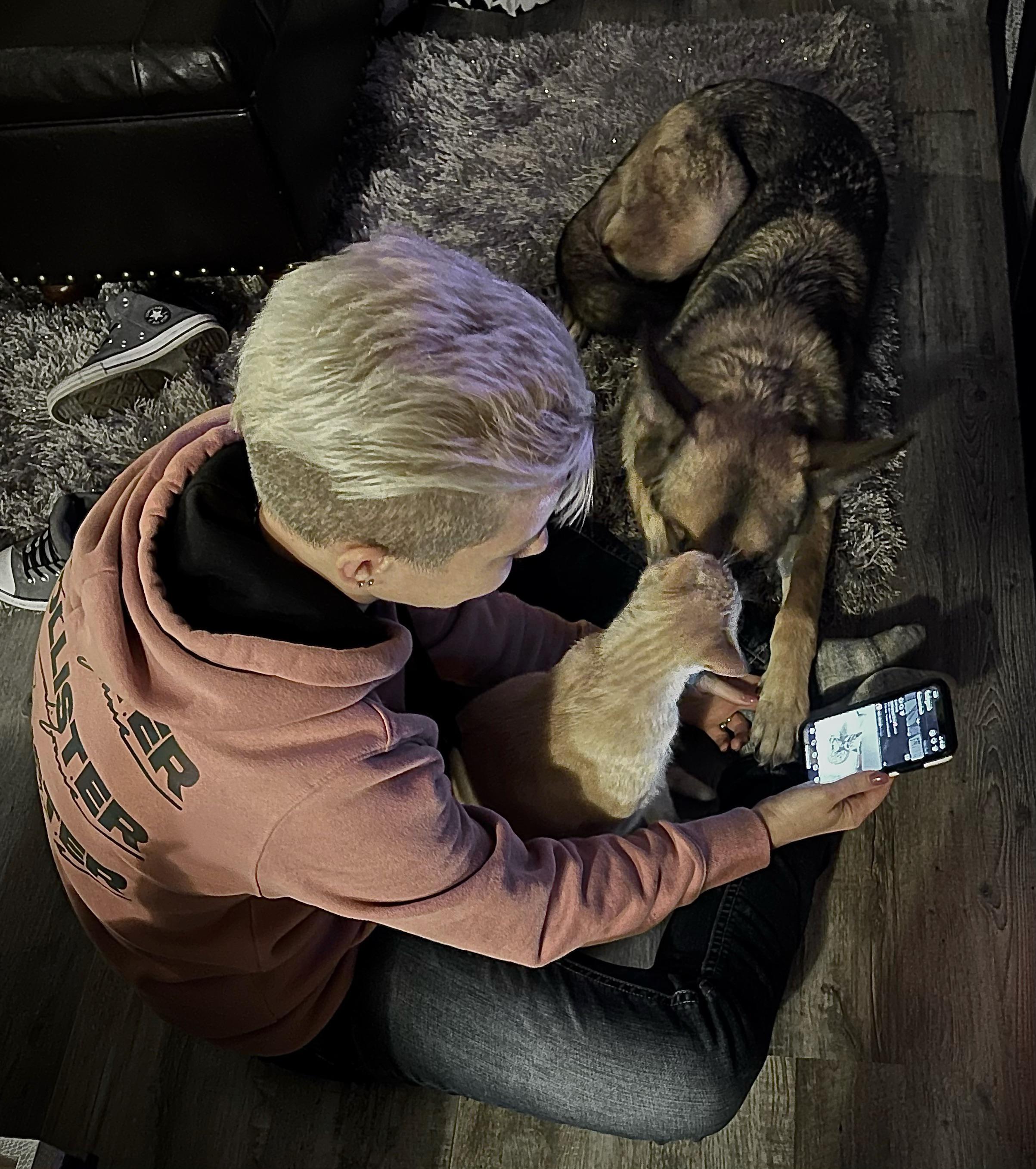 Sitting in front of the heater with my girls. | Scrolller