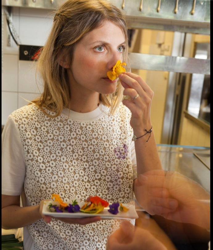 Smelling a flower | Scrolller