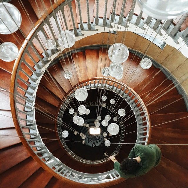 Spiral staircase with suspended glass orbs | Scrolller