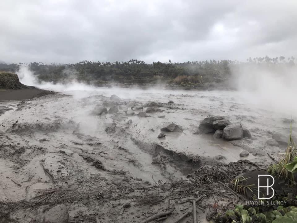 Steam rising off a river near a volcanic eruption in St. Vincent. | Scrolller