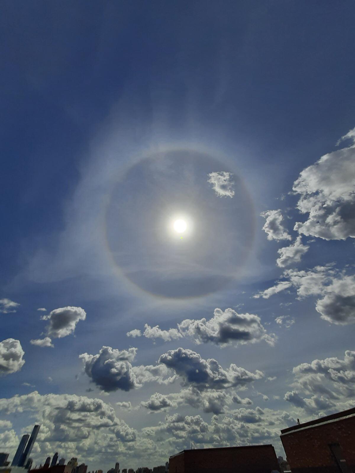 Sun dog, caused by ice particles in the upper atmosphere. | Scrolller