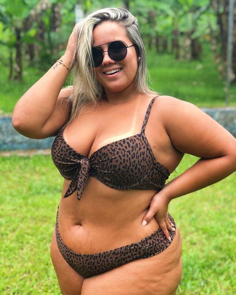 Tan and plump blonde in a leopard print bikini | Scrolller