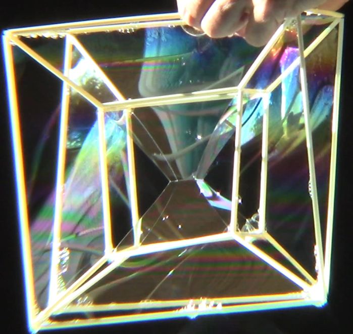 Tesseract Model Dipped In Bubble Solution Scrolller