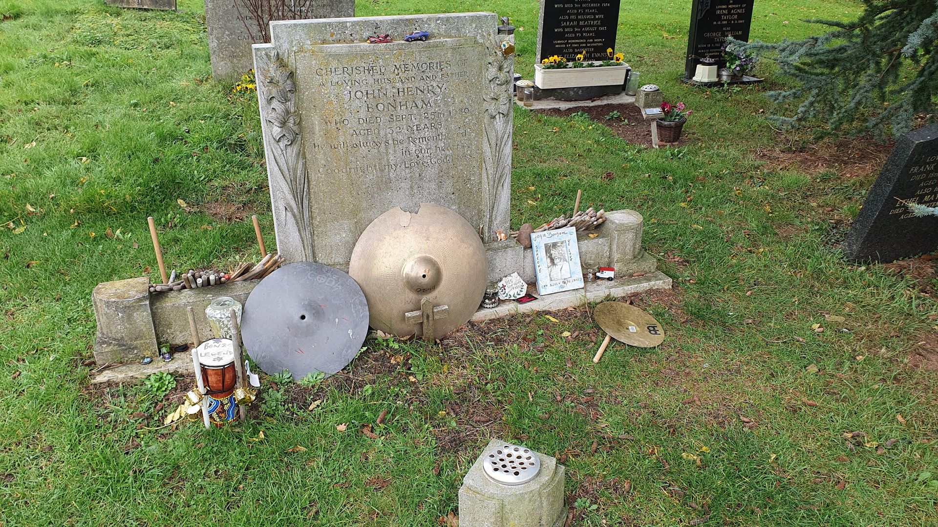 The late great John Bonham grave with a collection of drumsticks, Worcestershire, uk | Scrolller