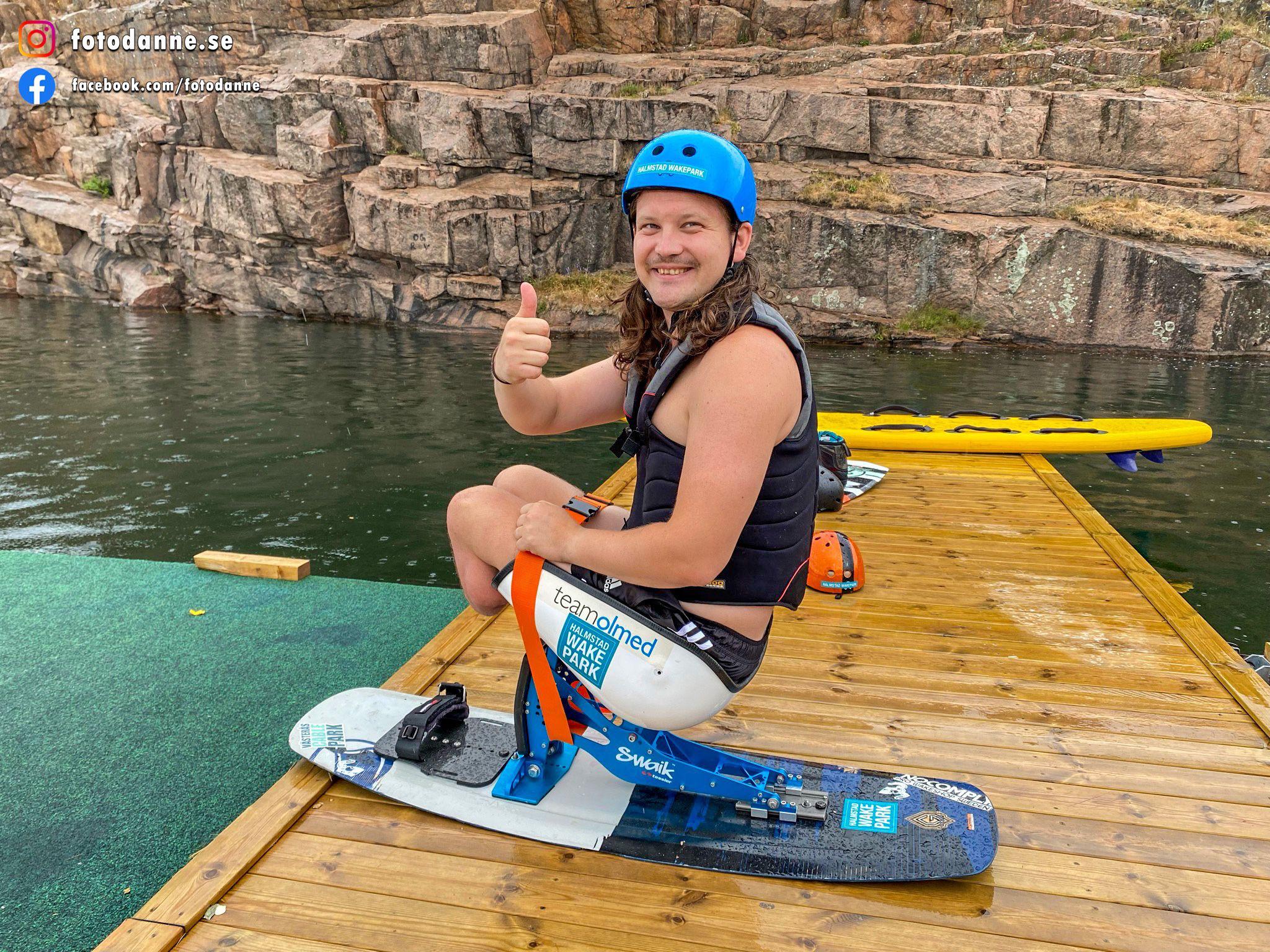 The sitwake. An adapted wakeboard with an adjustable seat. Makes wakeboarding available for ...