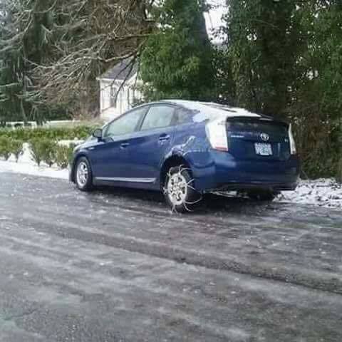 The snow chains are on the wrong wheels of this Prius | Scrolller