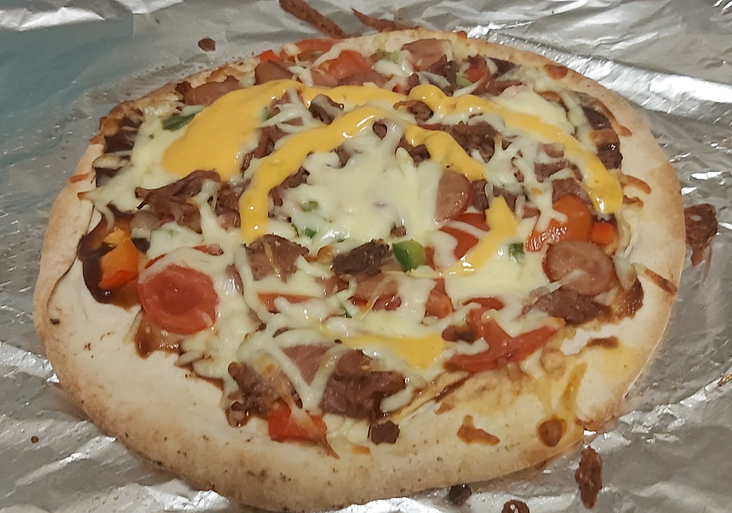 Thin and crispy pulled pork, cabannosi, and peri peri | Scrolller