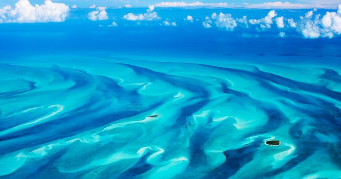 This isn't an oil painting. It's an aerial photo taken of the Bahama Banks. | Scrolller