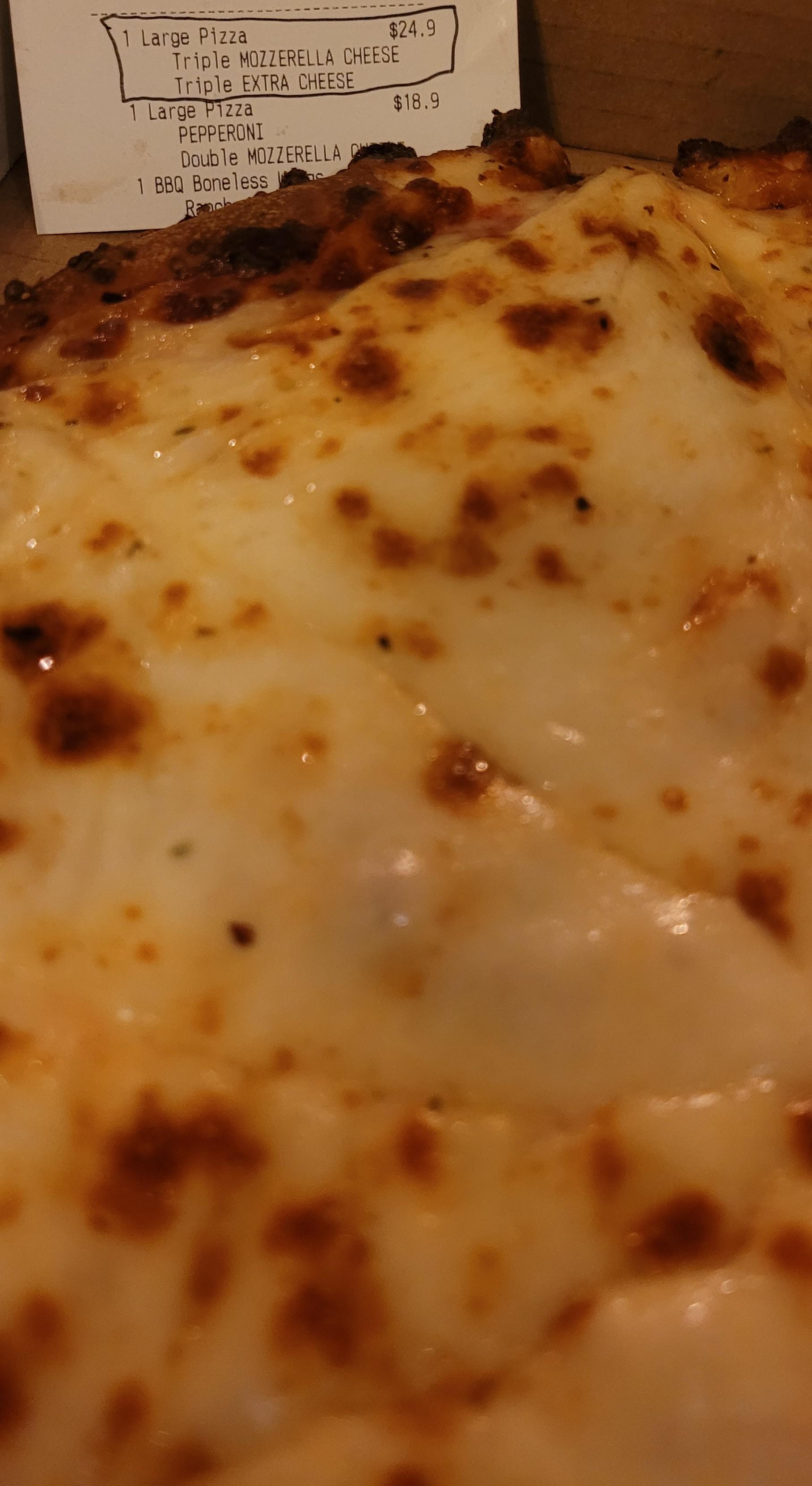 This pizza joint has the option for triple extra cheese on top of triple cheese | Scrolller