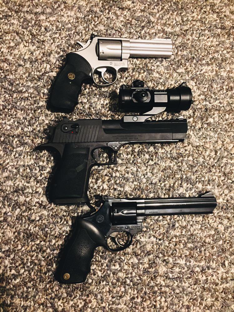 Top to Bottom: Stainless Steel S&W 4” Barrel .357 Magnum, .50 Cal Desert Eagle with brand new ...
