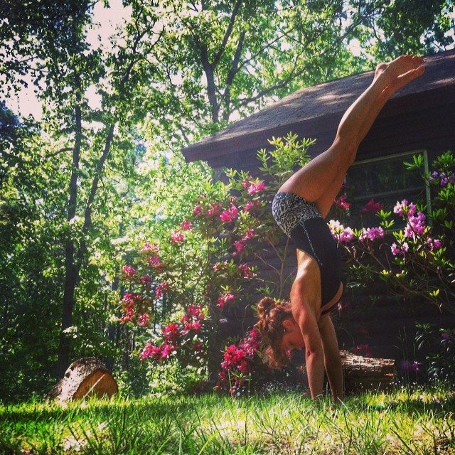 Woman Performing Handstand | Scrolller