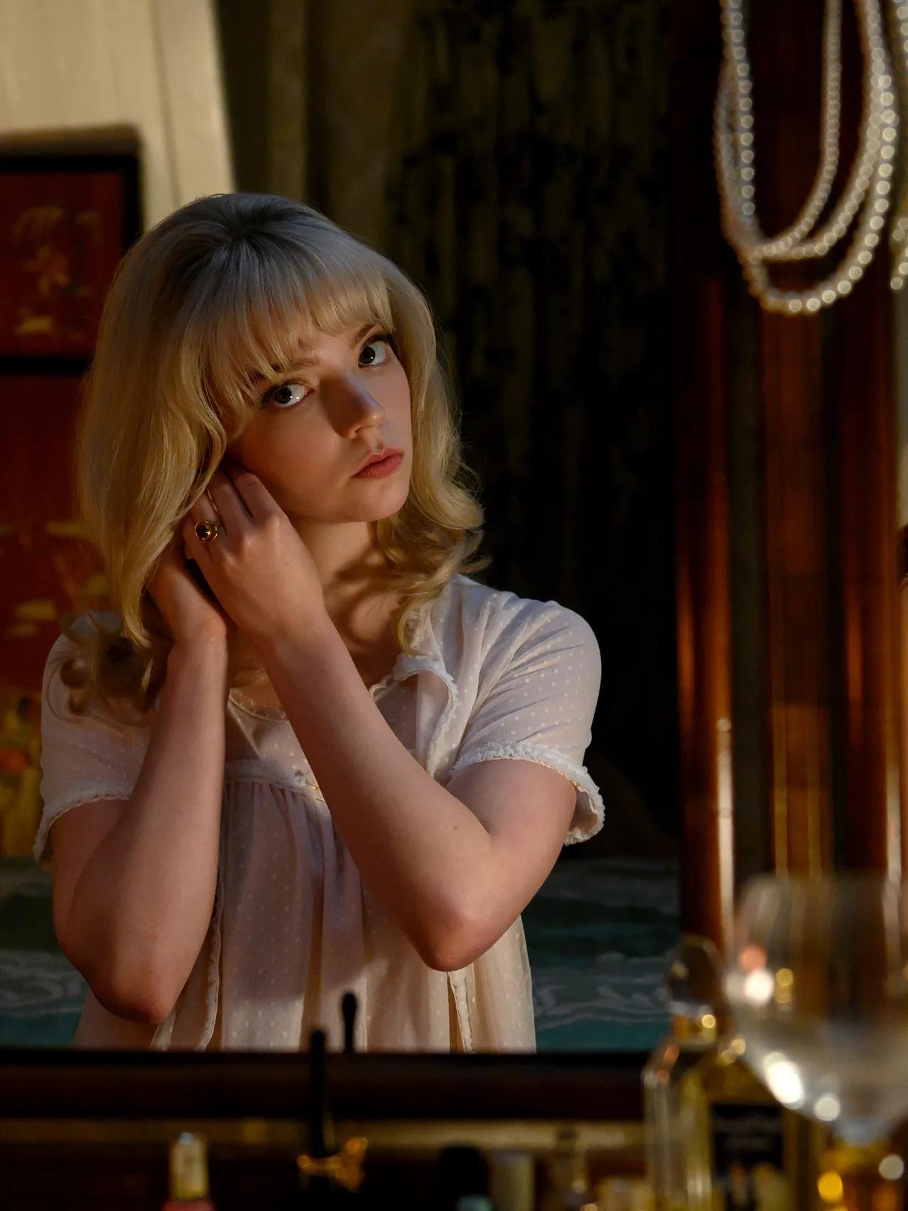 Applying earring | Scrolller