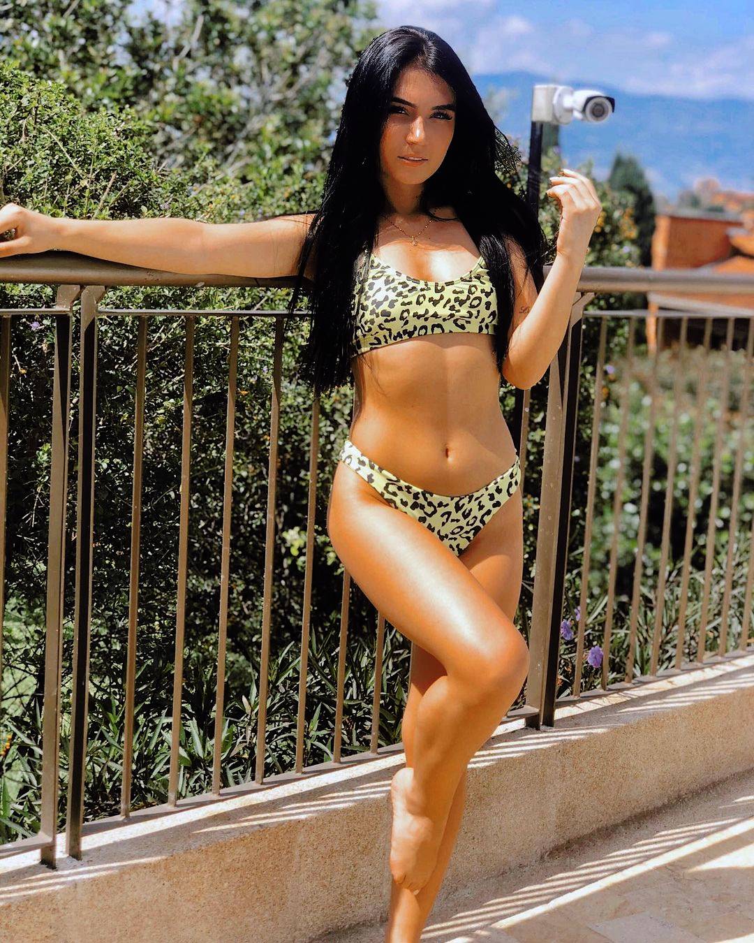 Babe in bikini posing outside | Scrolller