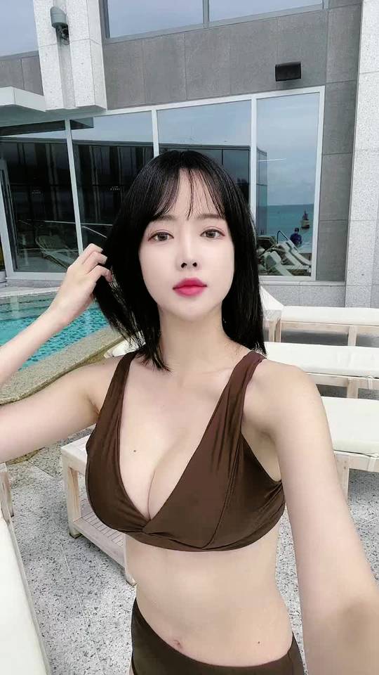 Busty bikini asian | Scrolller