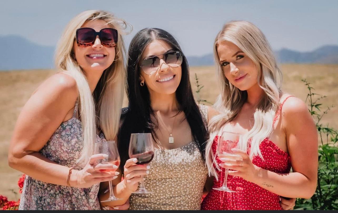 California girls enjoying wine | Scrolller