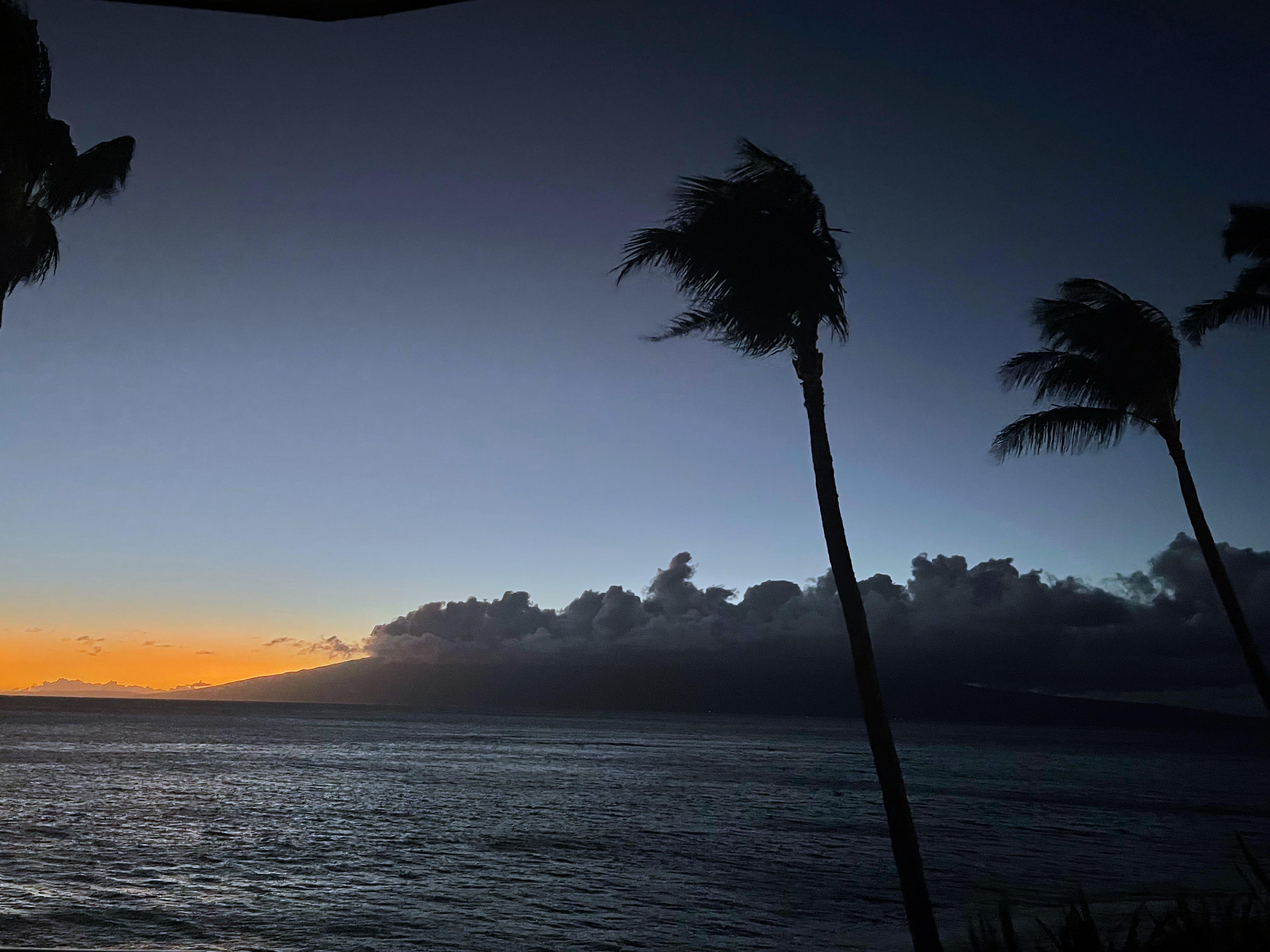 Clouds and sun setting over Moloka’i | Scrolller