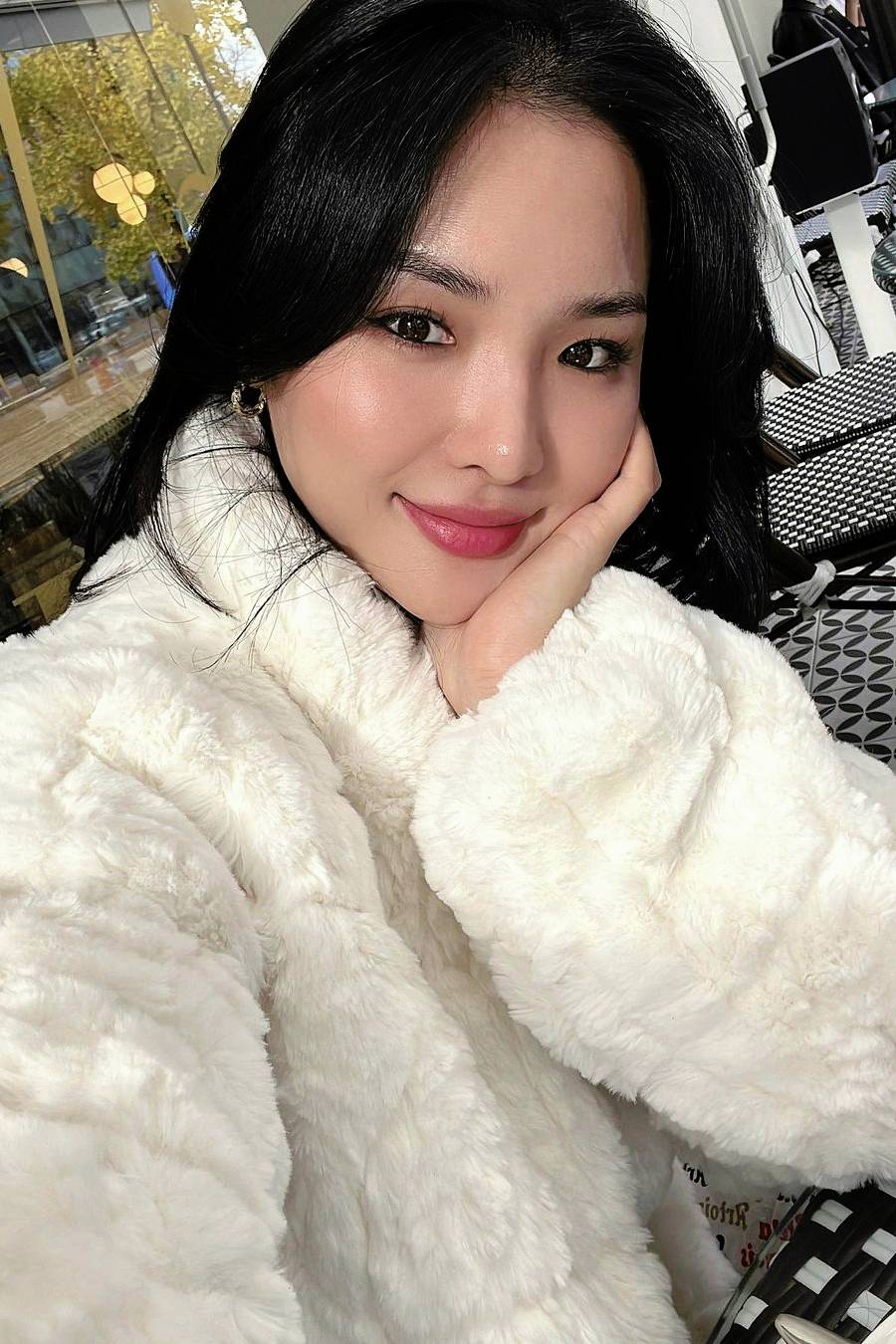 Cute smile in a furry white jacket | Scrolller