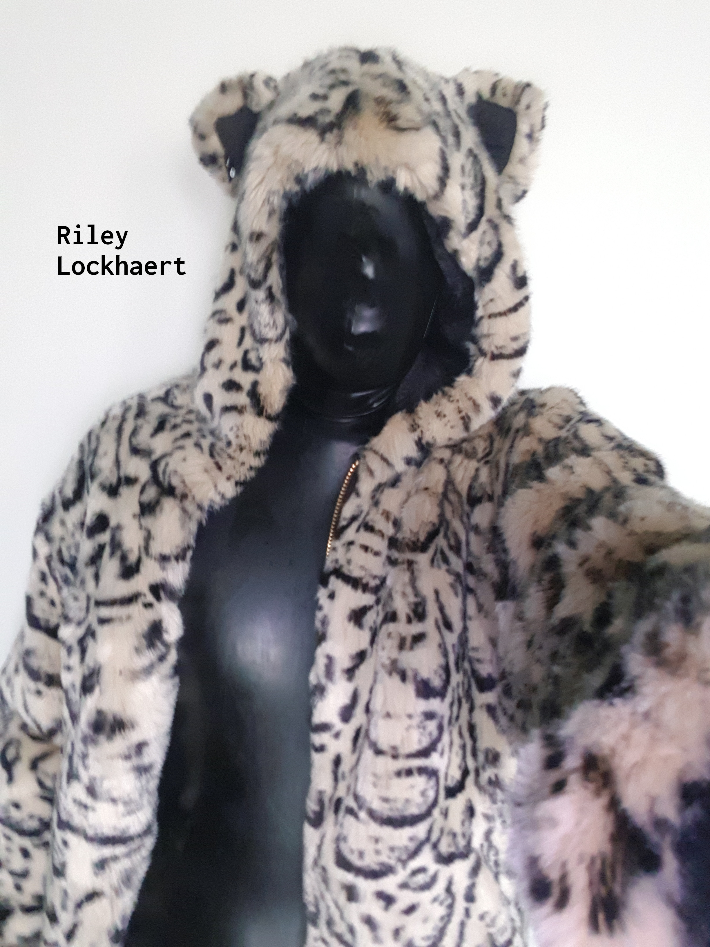 Latex suit with micro-perforated hood under fur bomber | Scrolller