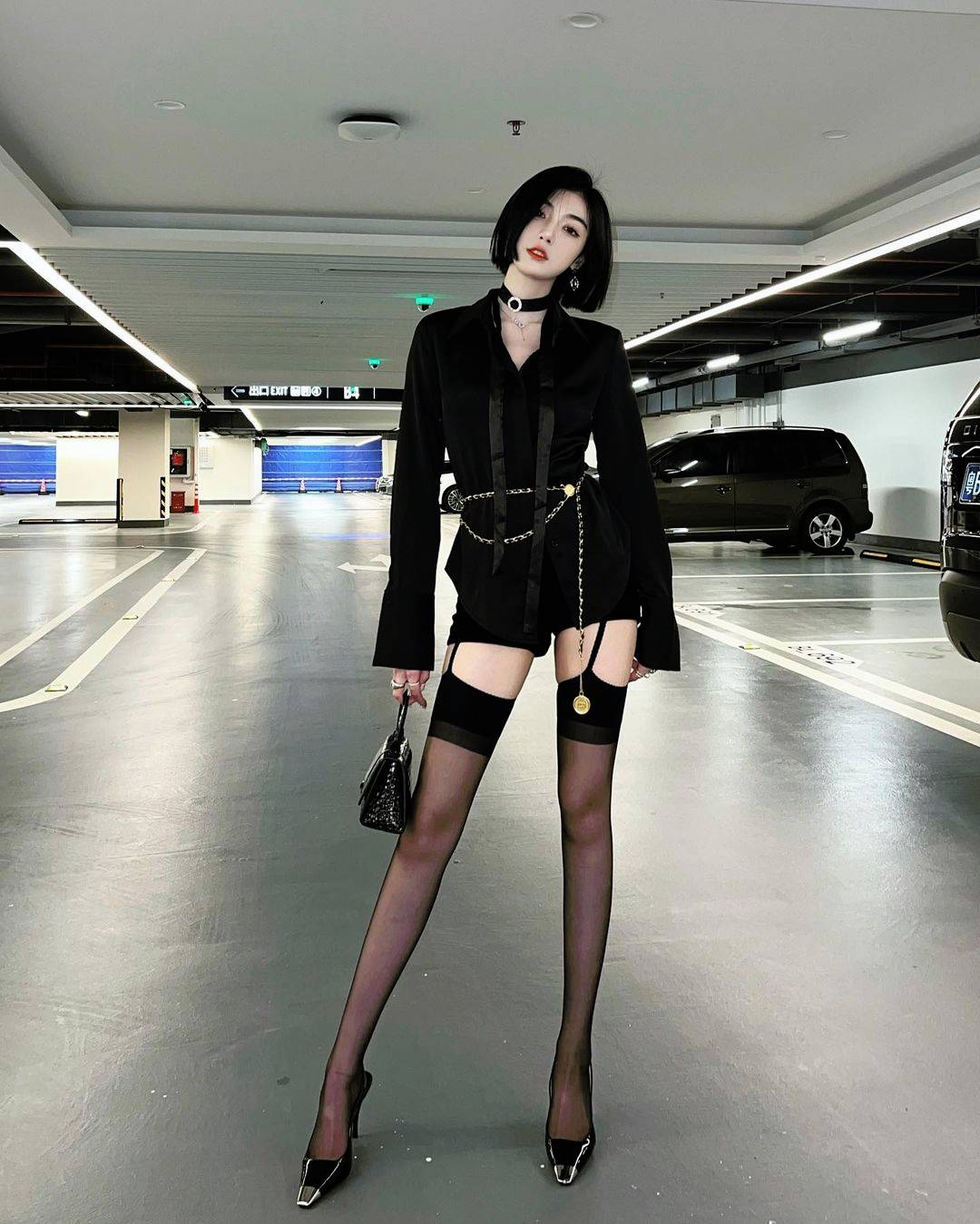 Leggy Asian In Black Stockings Scrolller