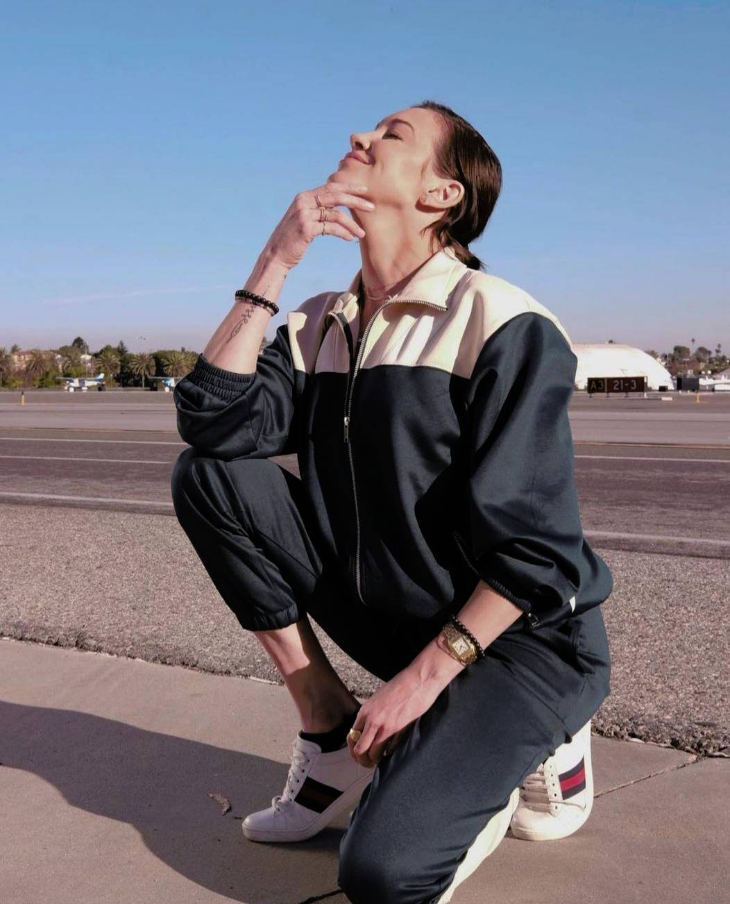 On her knee looking up | Scrolller