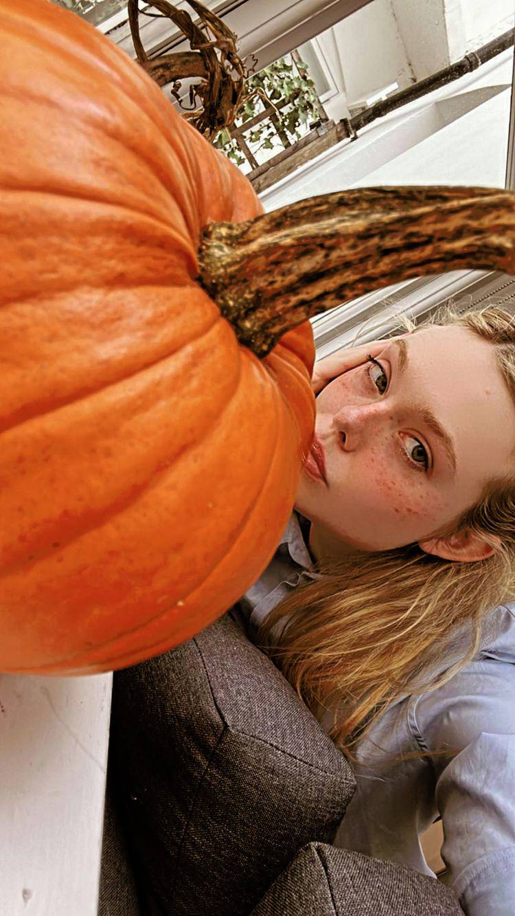 Posing with a pumpkin | Scrolller