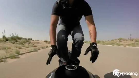 Standing on a motorcycle | Scrolller