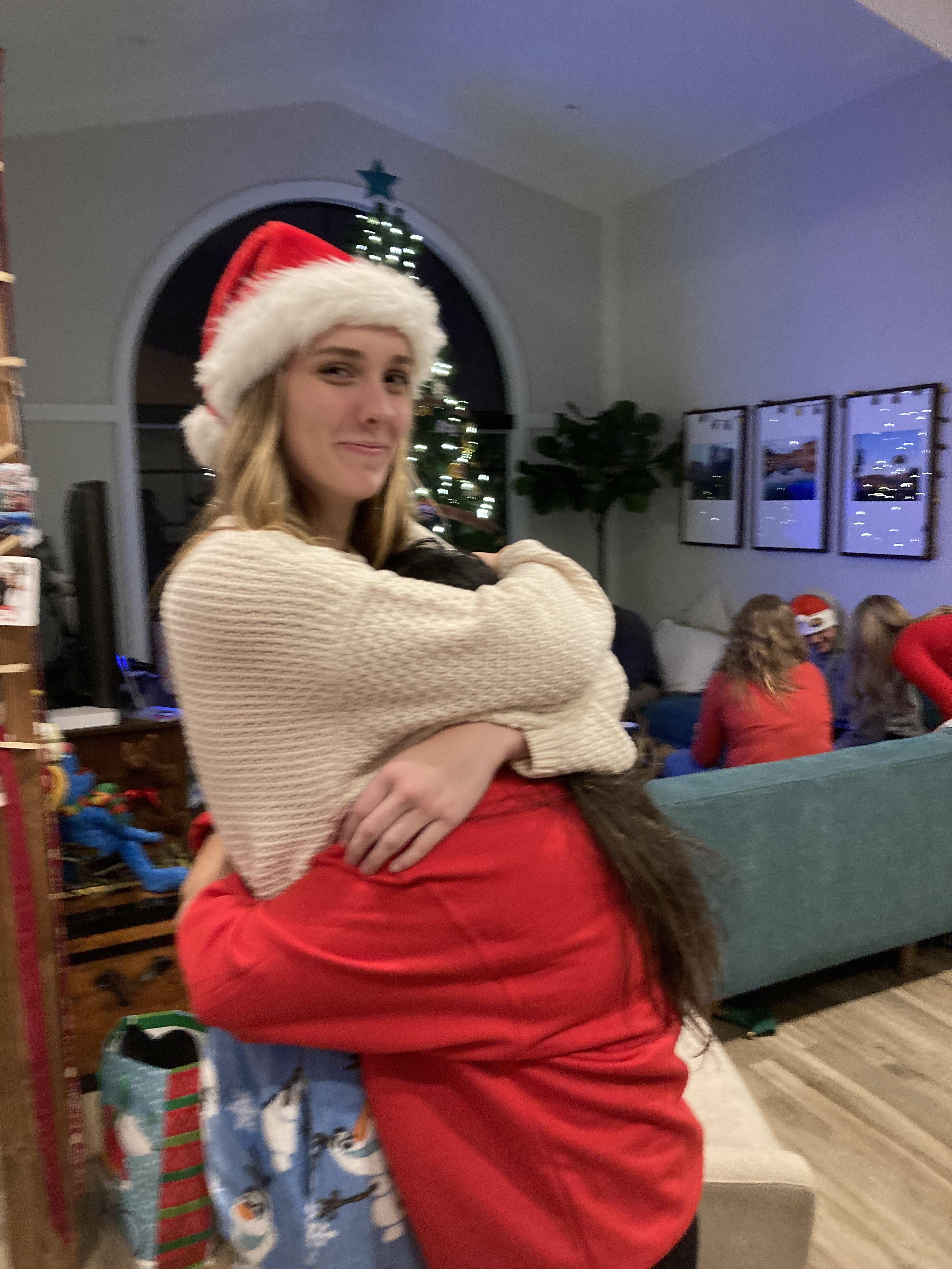 Tall Girl Hugs Small Girl Scrolller