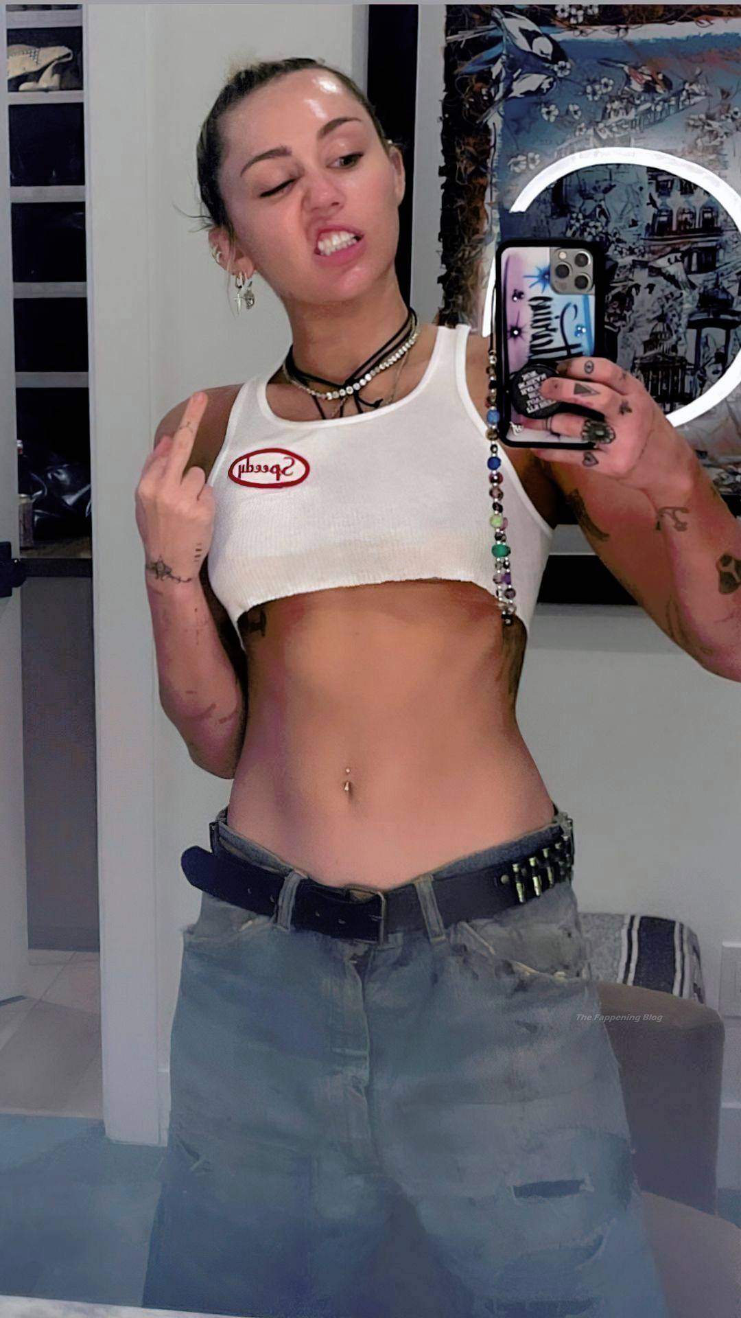 The middle finger is up by Miley | Scrolller