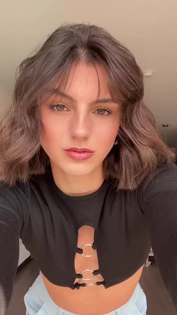 TikTok in black top | Scrolller