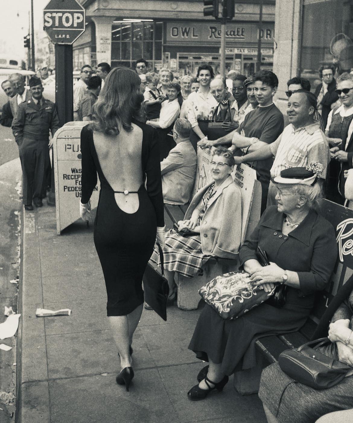 Vikki Dougan walking down the street in Los Angeles, 1957 | Scrolller