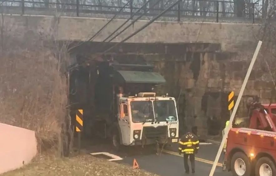 A garbage truck got stuck under a railroad bridge near me | Scrolller