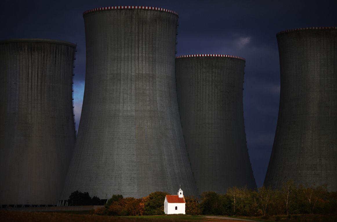 A nuclear power plant built in a beautiful wheat field near a chapel. (Czech republic) | Scrolller