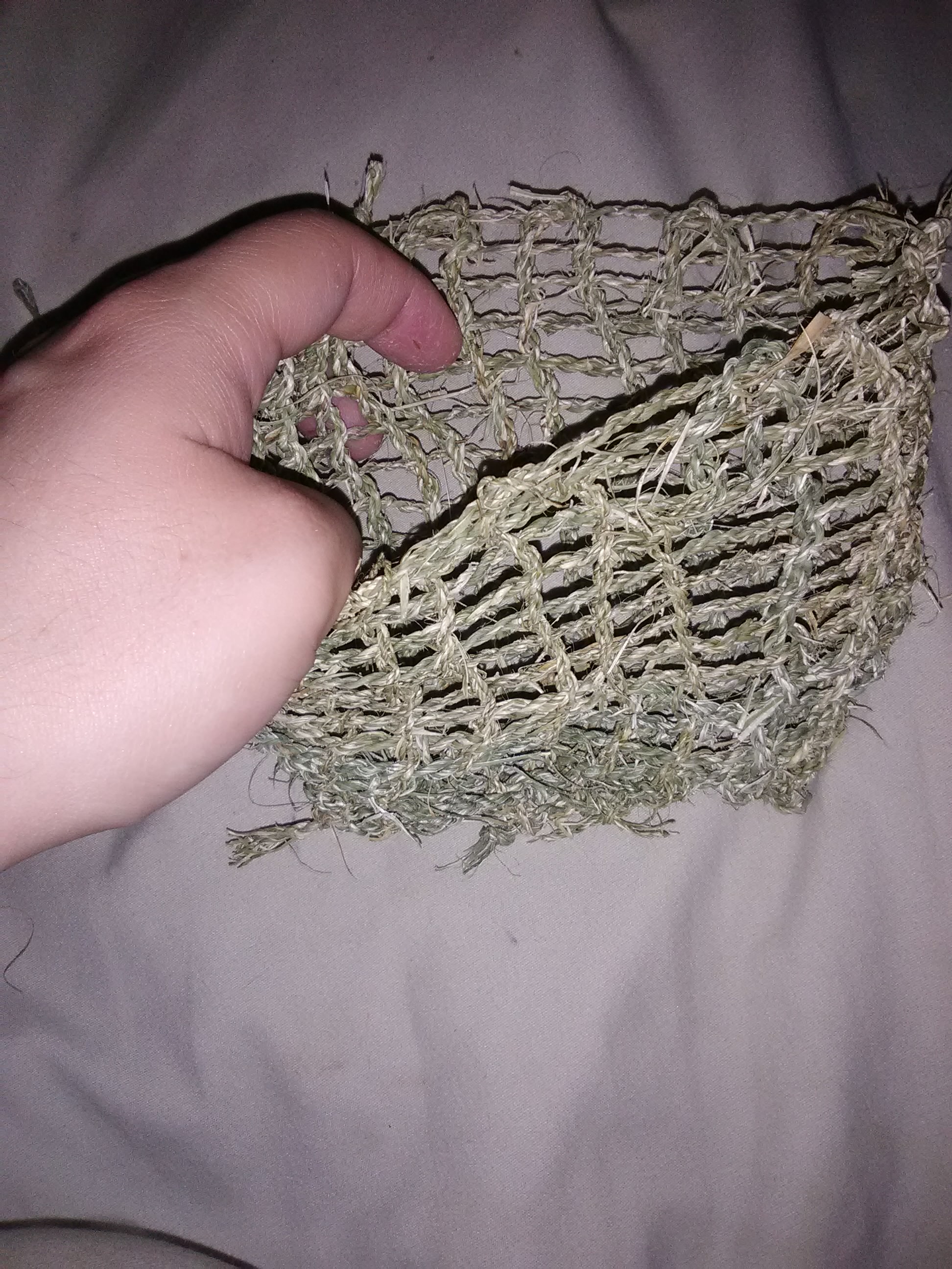 A pouch I made out of cattail leaf cordage. | Scrolller