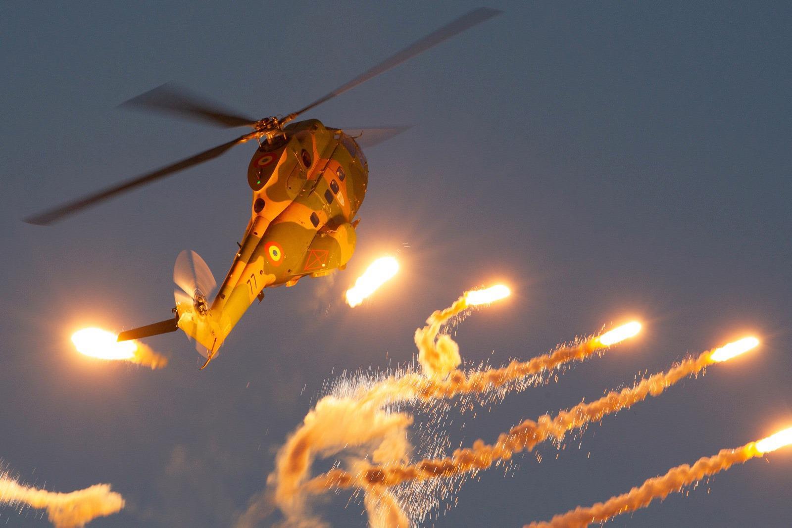 A Romanian Air Force IAR330M shoots flares during the yearly Bucharest International Air Show ...