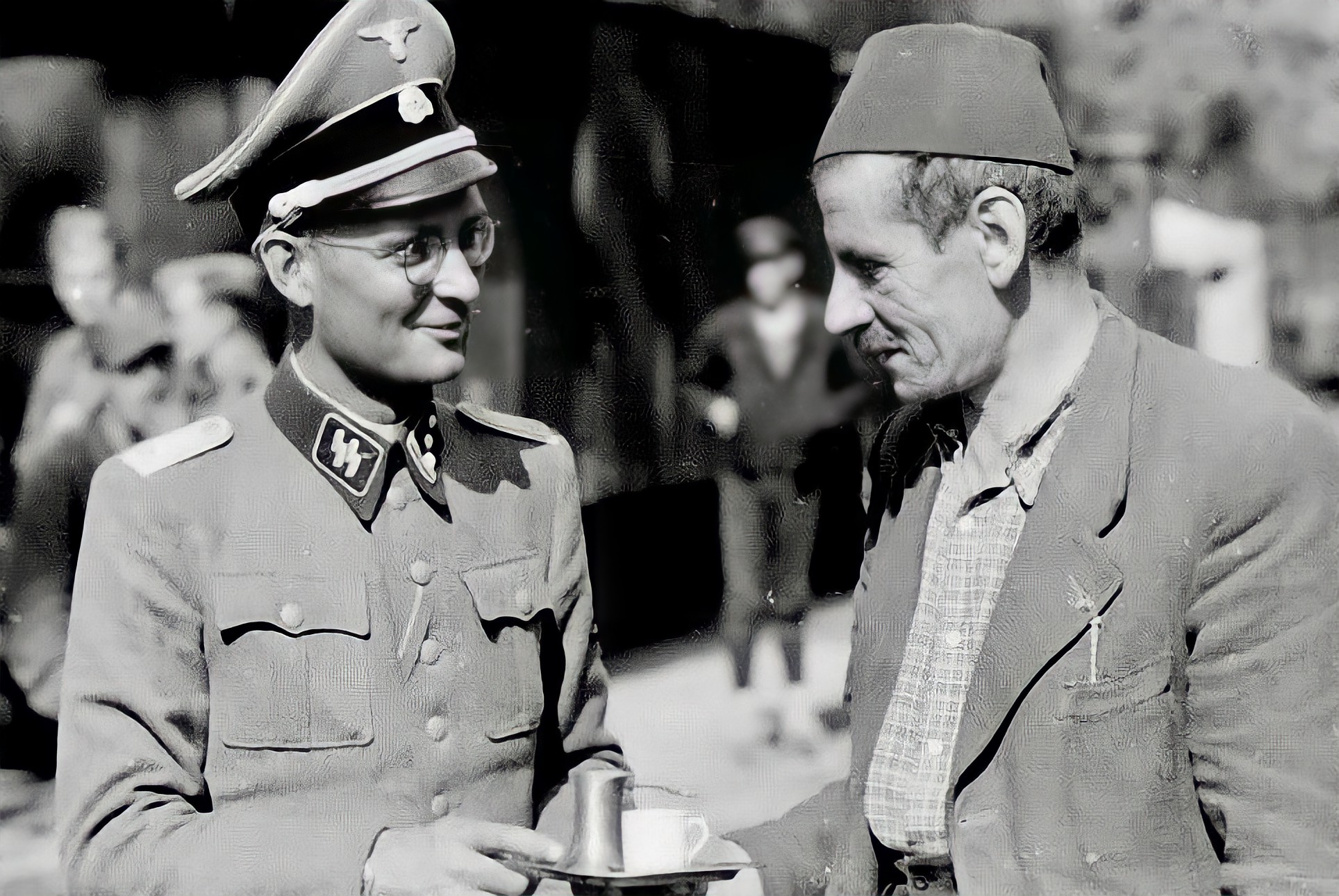 A Waffen-SS Officer speaking to a local Bosniak in Sarajevo, 1943. [1928x1290] | Scrolller