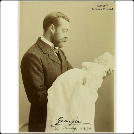 A young George V, holding his first son, the future King Edward VIII. (circa 1894.) | Scrolller