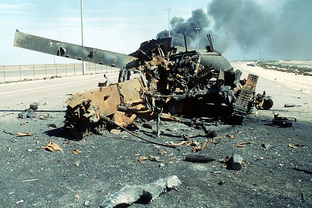An Iraqi main battle tank on a highway south of Kuwait City destroyed in a Coalition attack ...
