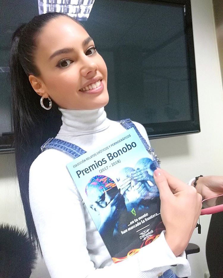 Apolonia Lapiedra, with book | Scrolller