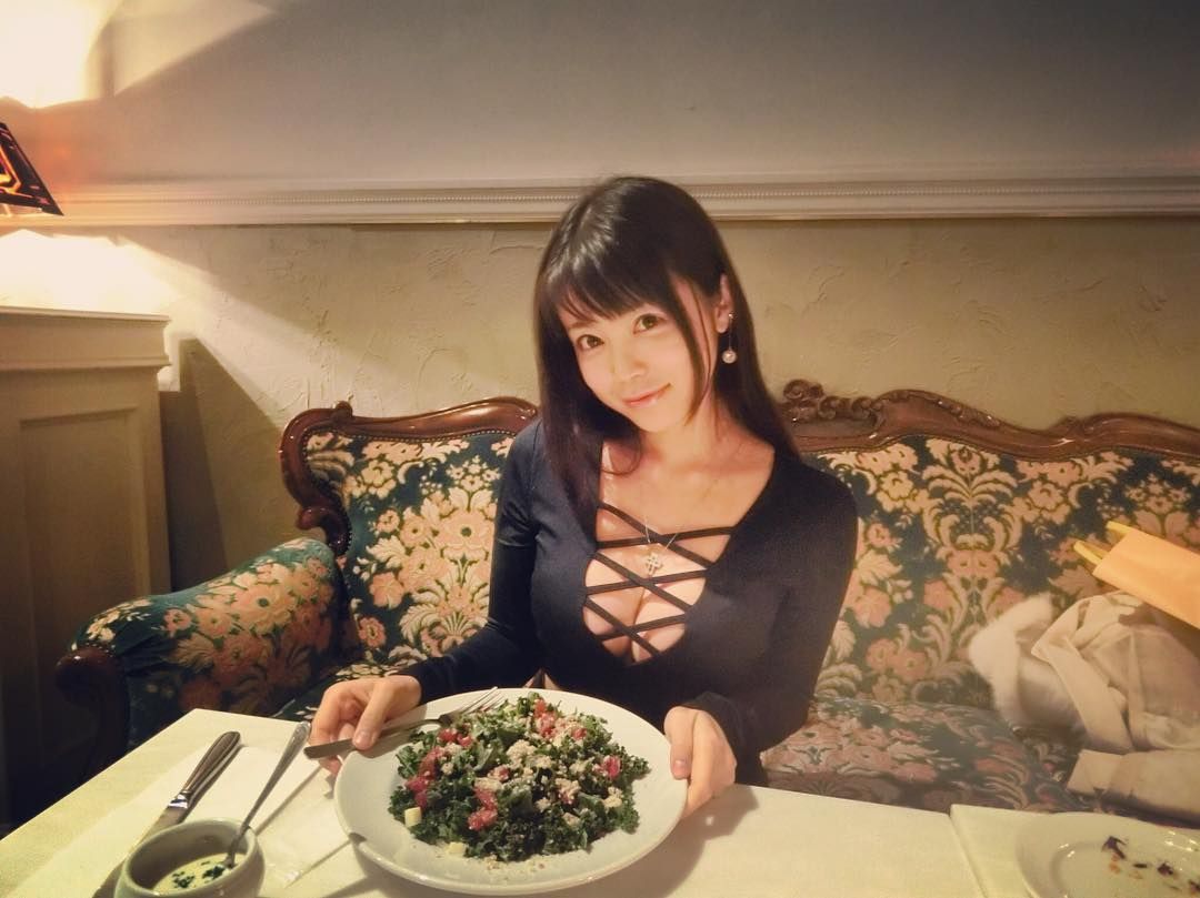 Asian girl with a big salad | Scrolller