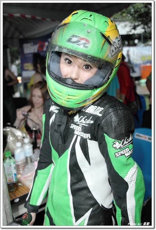 Asian rider in full gear and helmet | Scrolller