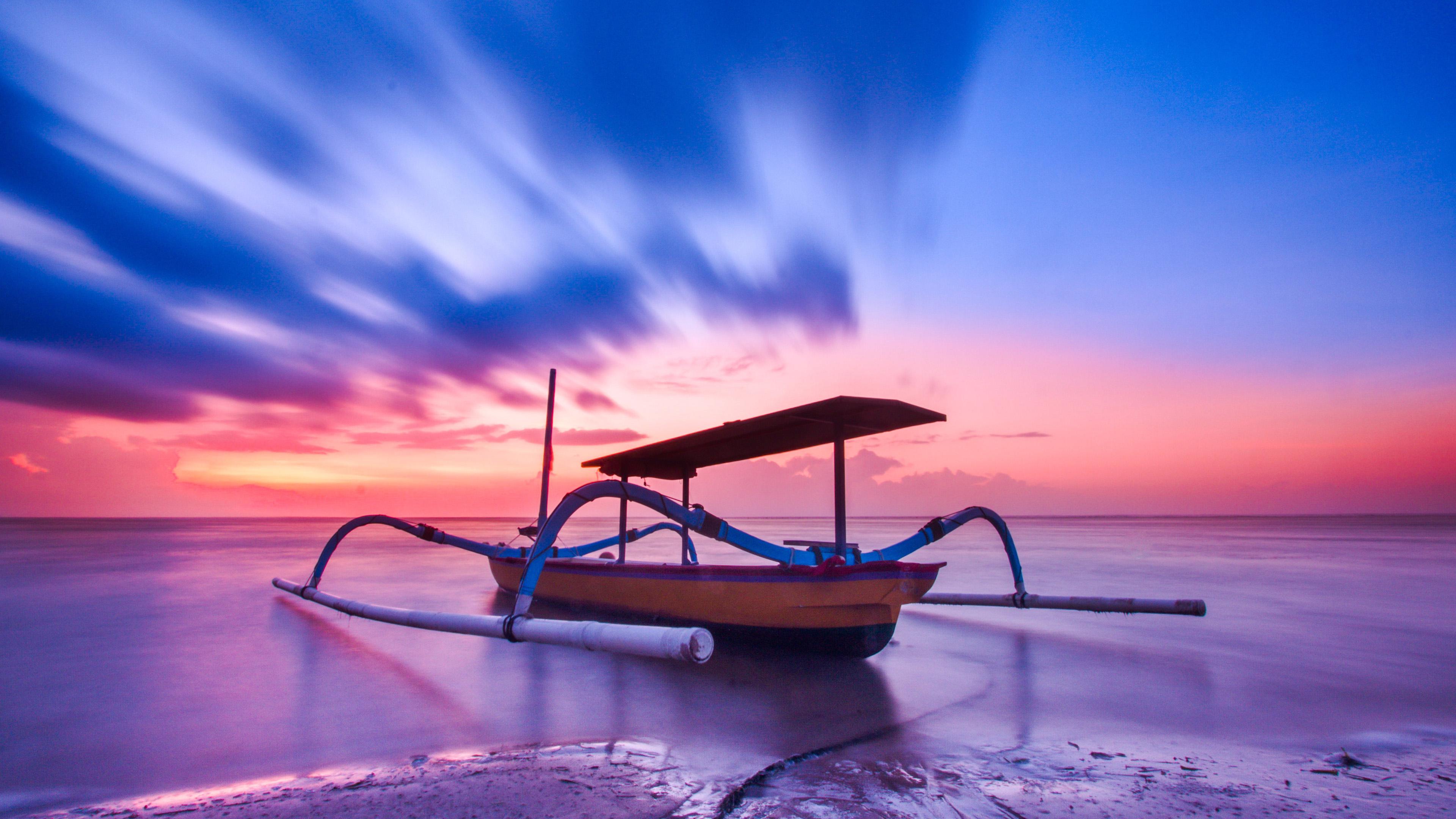 Boat during Orange Sunset | Scrolller