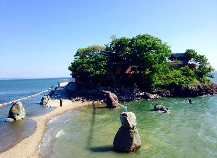 Buddhist temple in Ganwoldo, Seosan before the sea tide rose. | Scrolller
