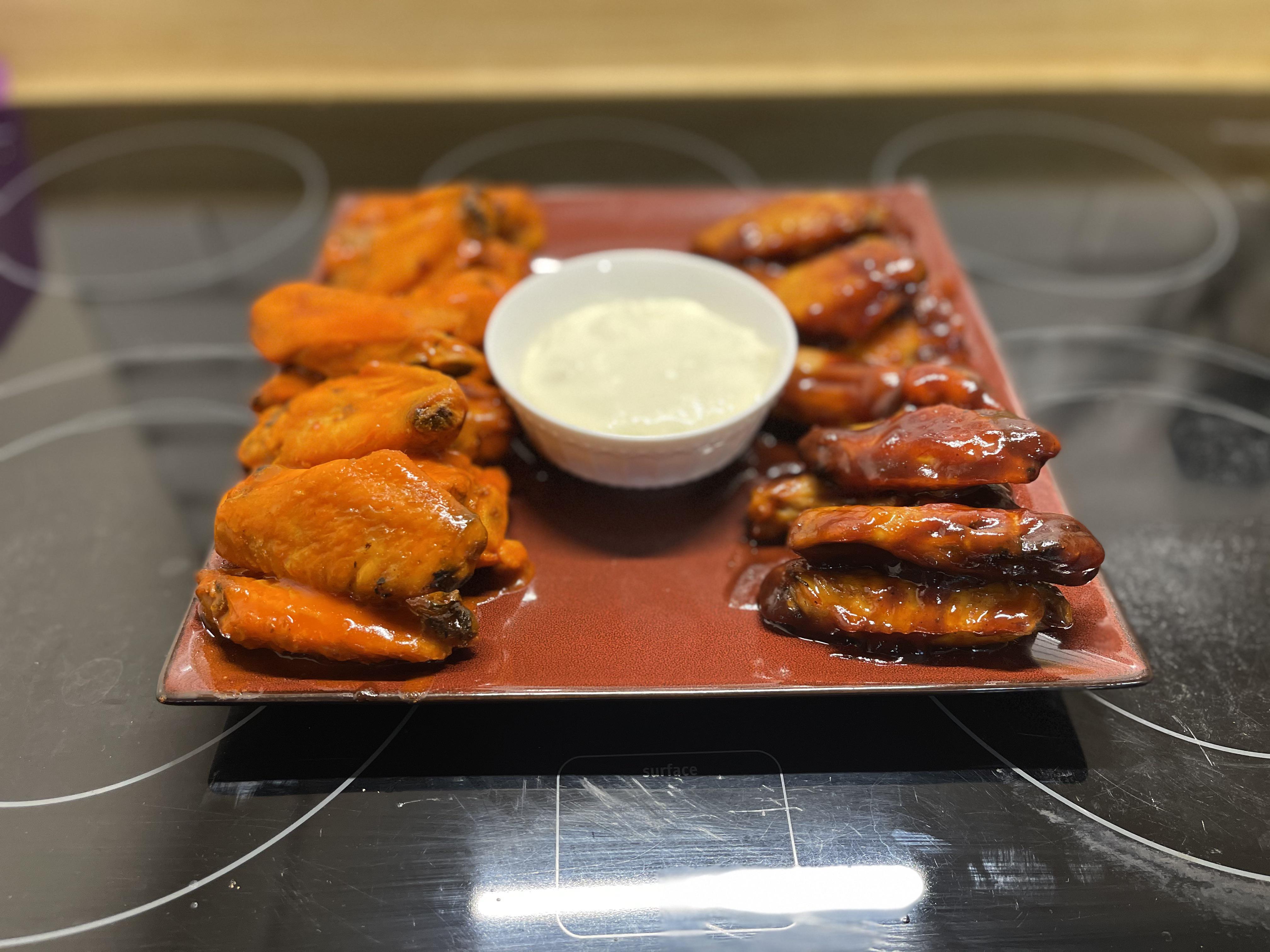 Can’t go wrong with wings. Buffalo on the left, honey bbq on the right. | Scrolller