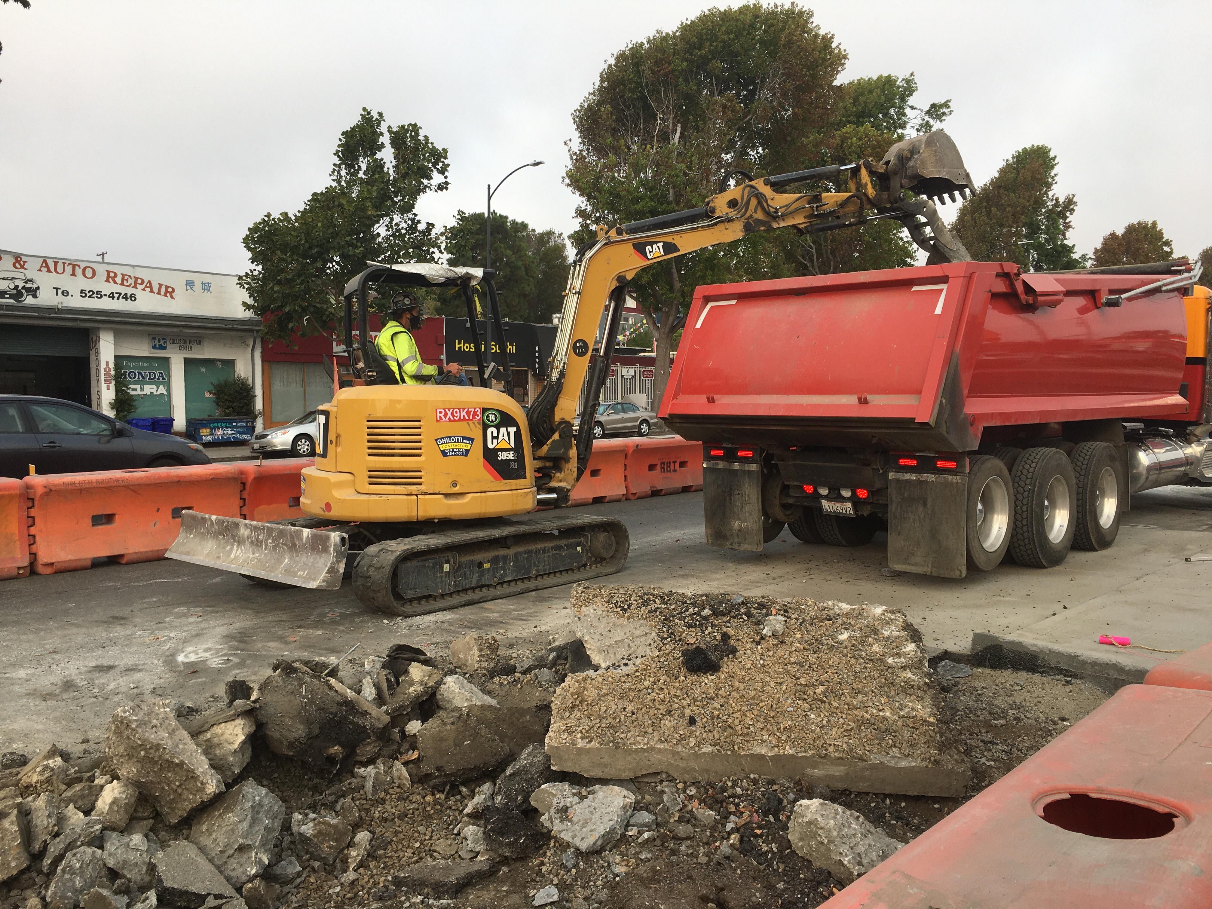 Cat 305e2 mini excavator loading dump truck | Scrolller