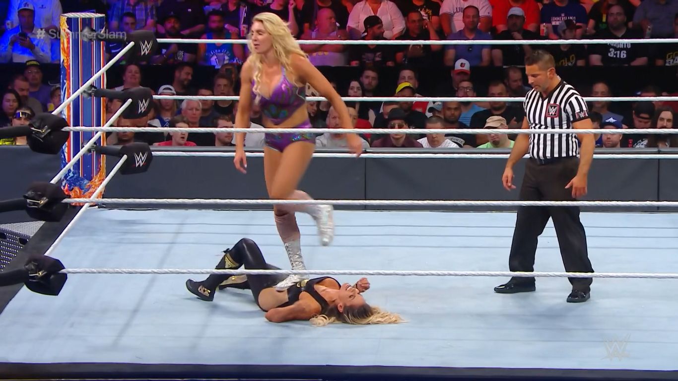 Charlotte stepping on Trish Stratus' belly | Scrolller