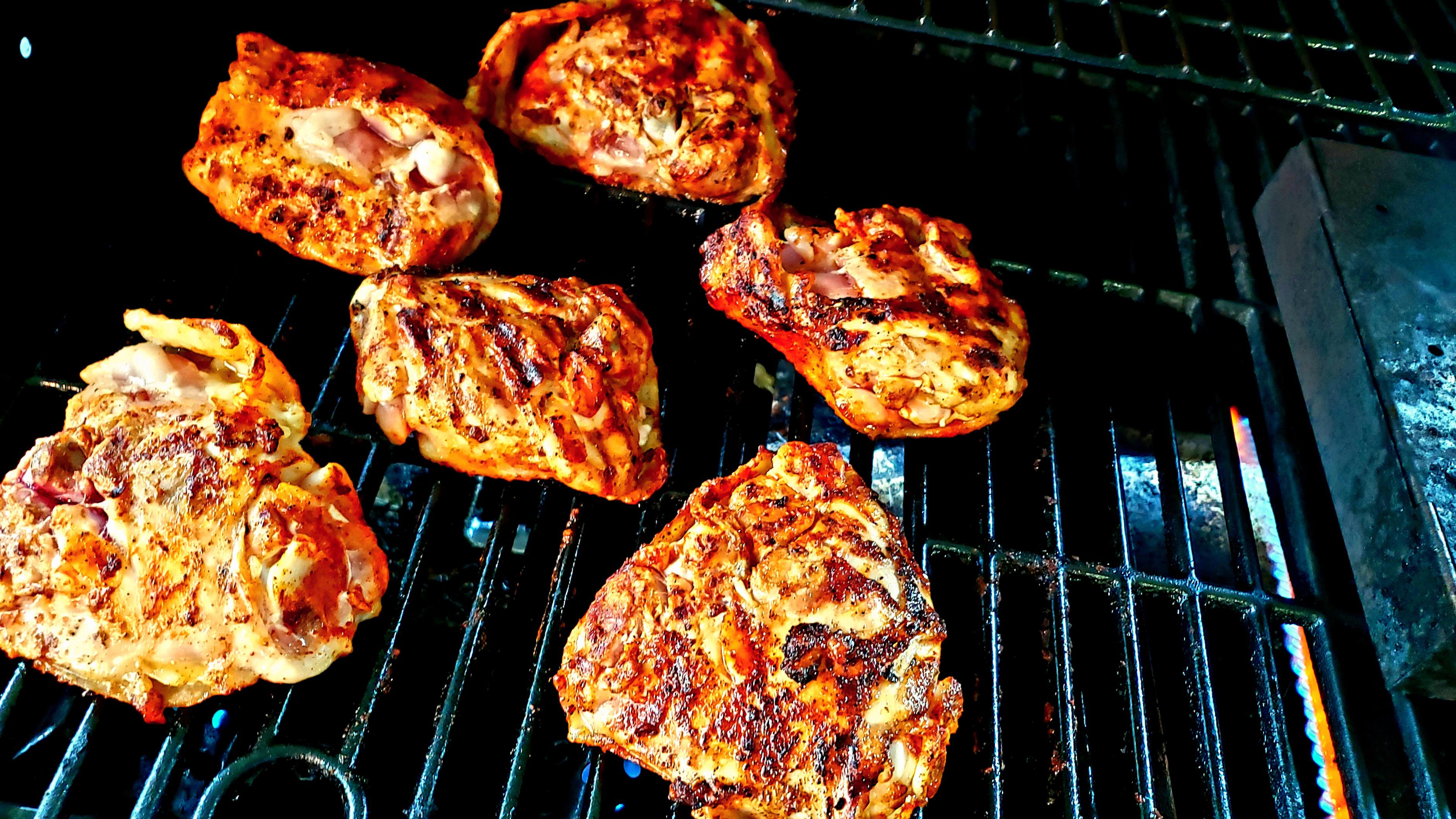 Chicken thighs on the grill | Scrolller