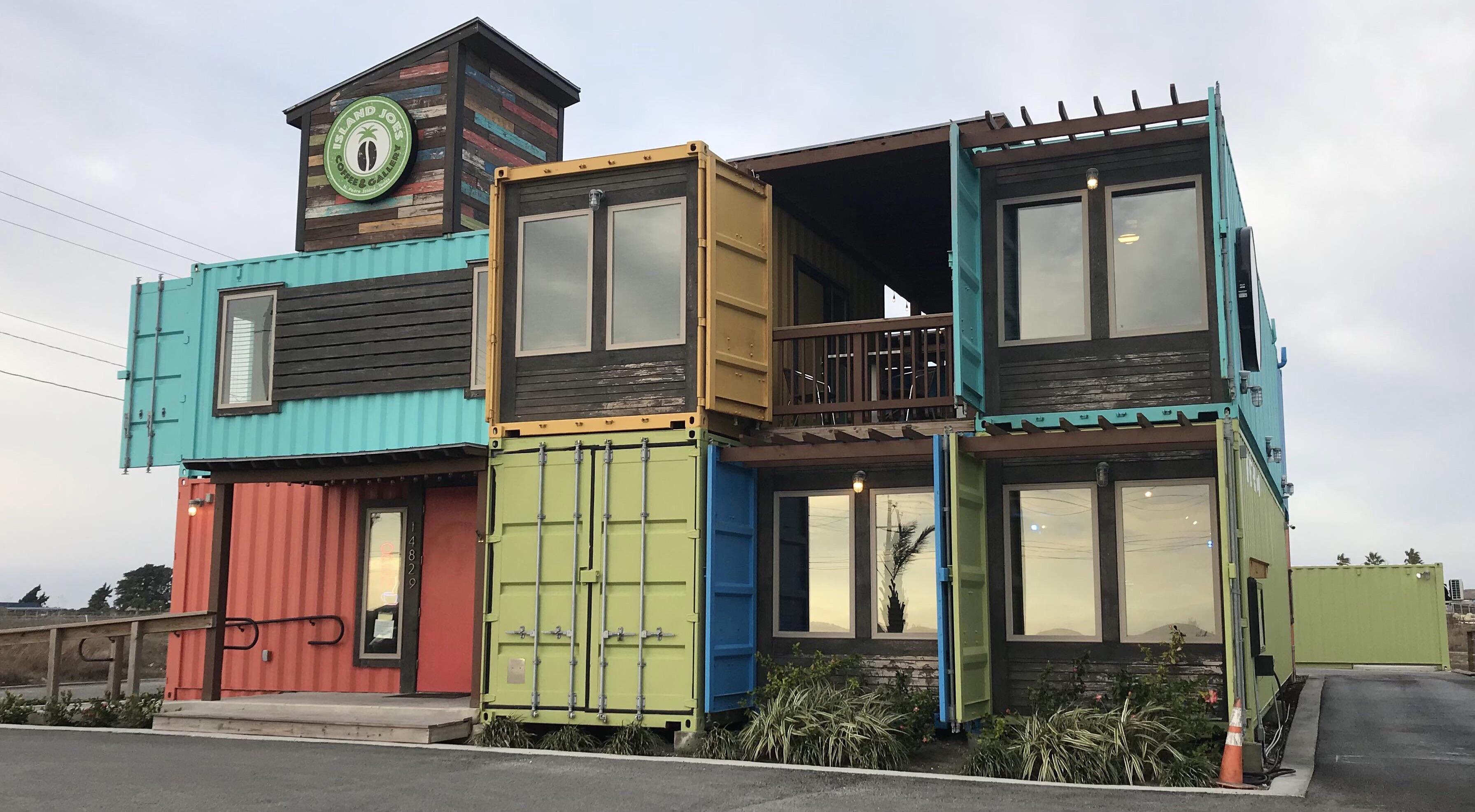 Coffee shop built out of brightly colored shipping containers. | Scrolller