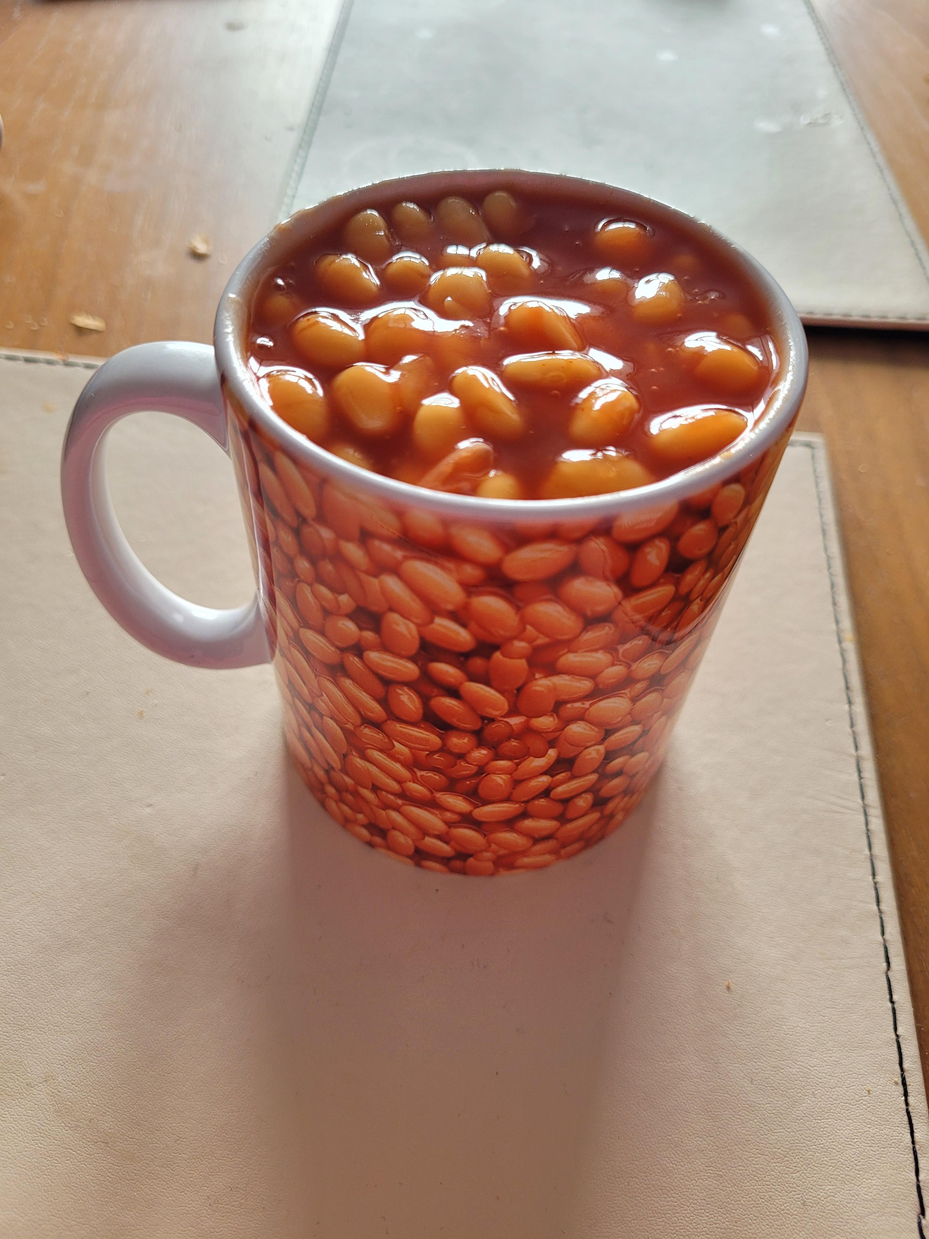 Cold baked beans out of a baked bean mug | Scrolller